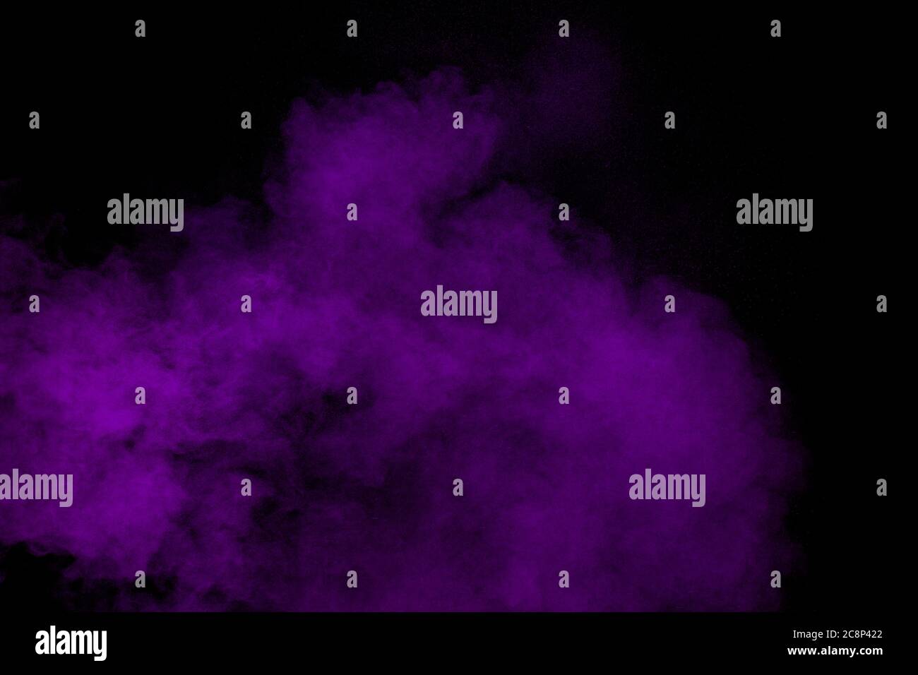 Abstract purple powder explosion on black background, Freeze motion of ...