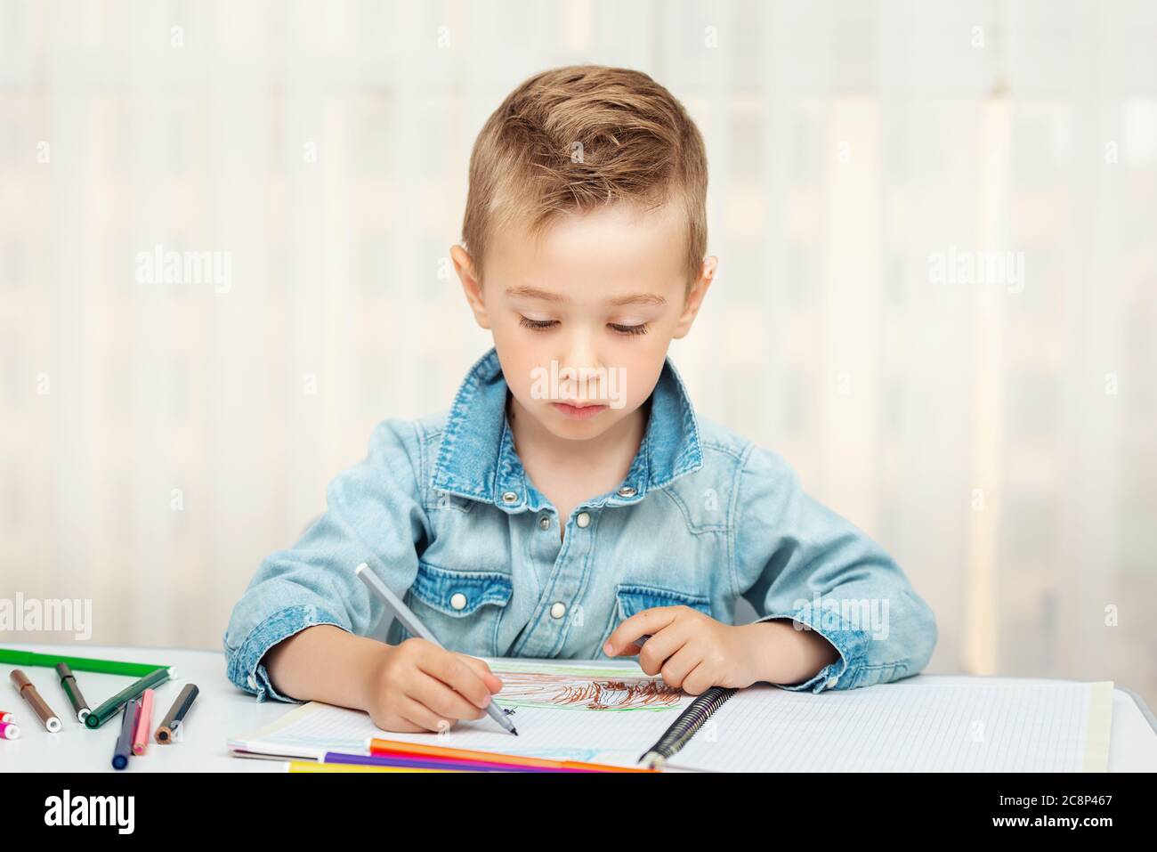 Adorable kid boy drawing marker hi-res stock photography and images - Alamy