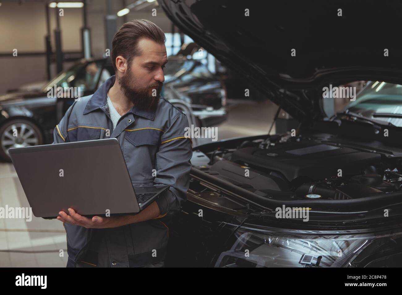Experienced car technician using hi-res stock photography and images ...