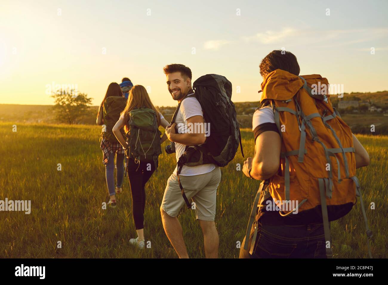 Hike. Hiking. Tourism.A group of tourists with backpacks are walking ...