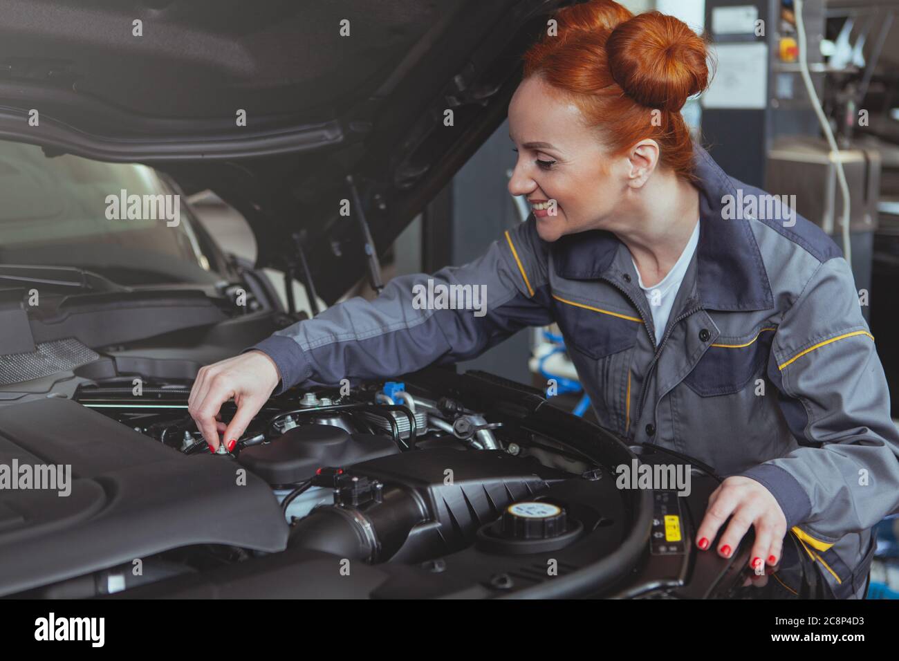 Car engine factory woman hi-res stock photography and images - Alamy