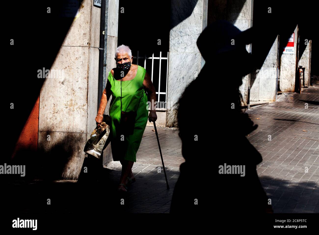 Old woman with walking stick in the street, Barcelona, Spain Stock ...