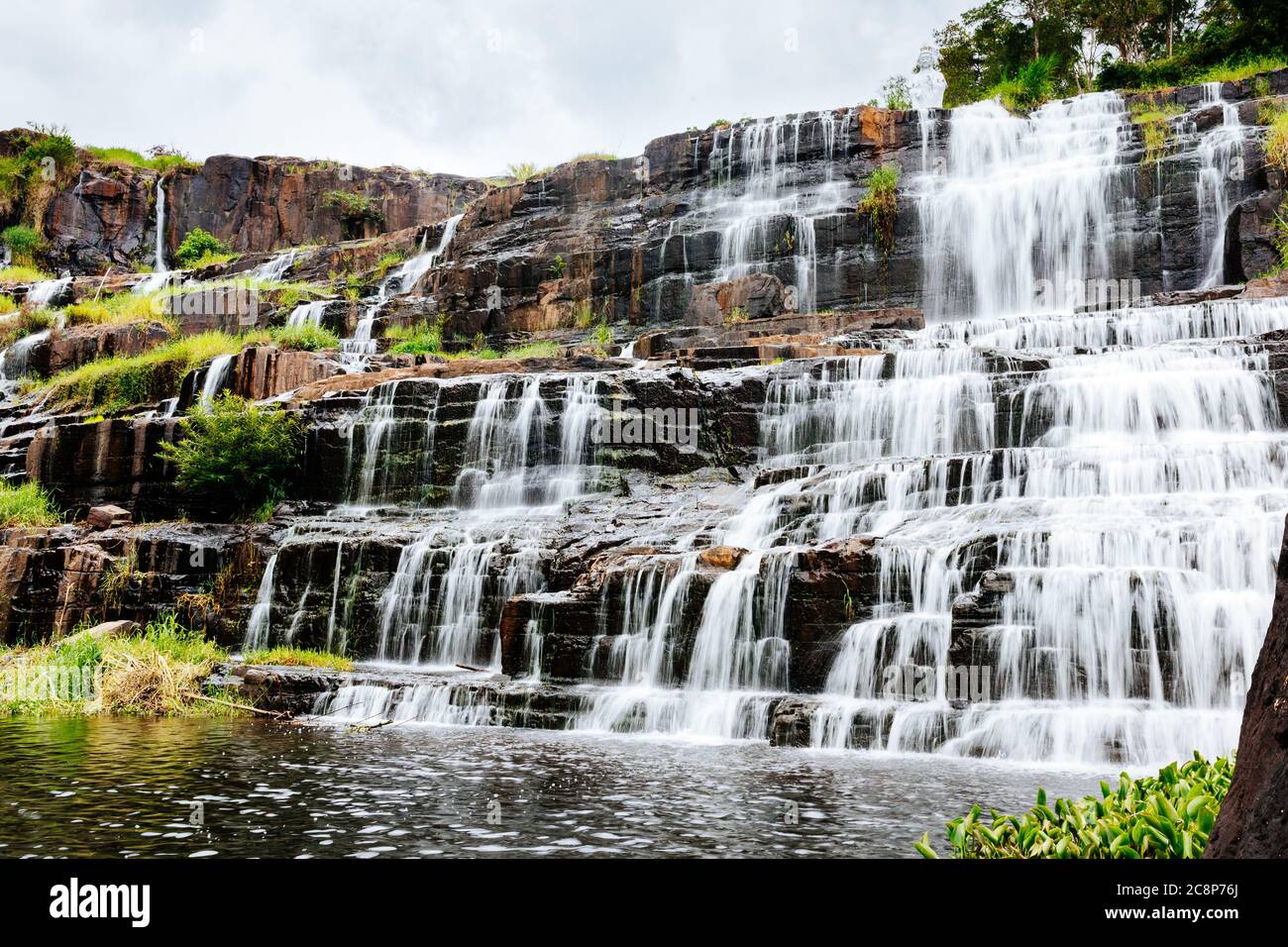 Beautiful, wide waterfall in a popular tourist spot. A powerful stream ...