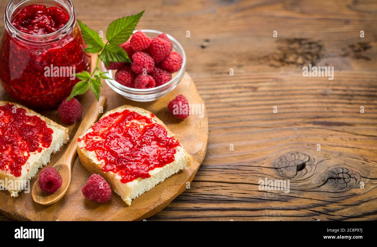 Raspberry jam on the bread Stock Photo - Alamy