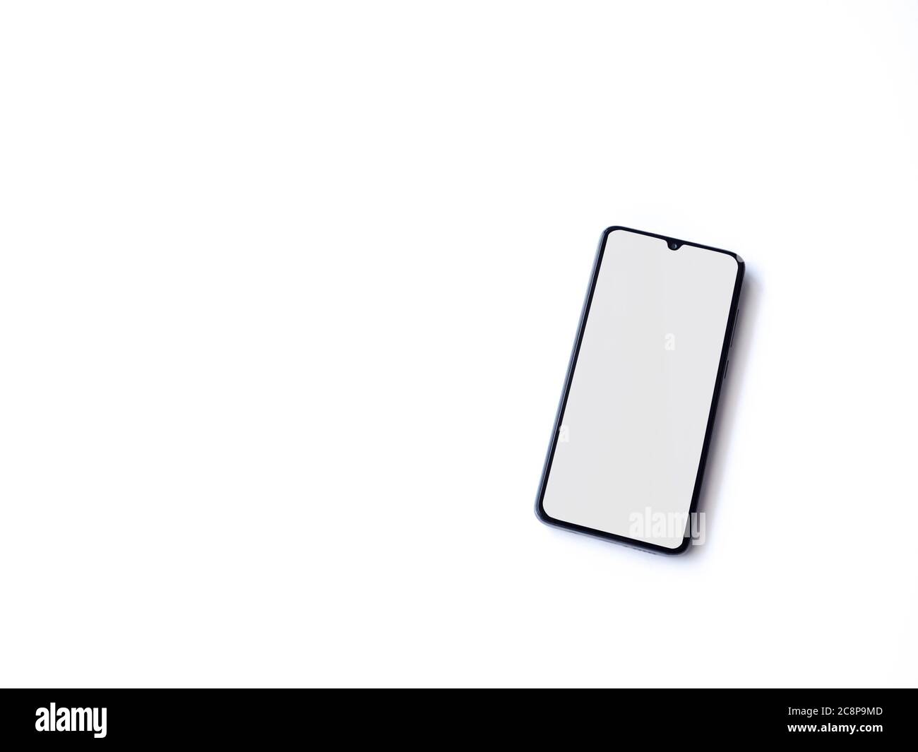 Black mobile smartphone mockup lies on the surface with blank screen ...