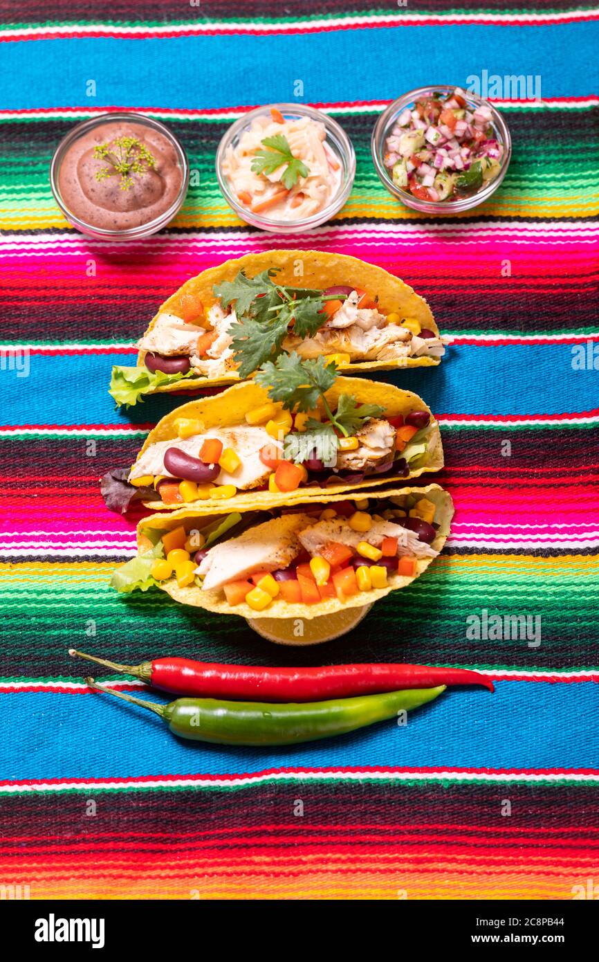 three mexican tacos on cloth Stock Photo - Alamy