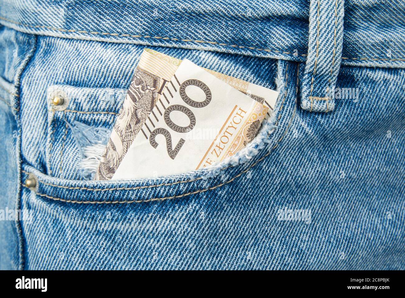 money in jeans pocket. two hundred zloty bill in a pocket Stock Photo ...