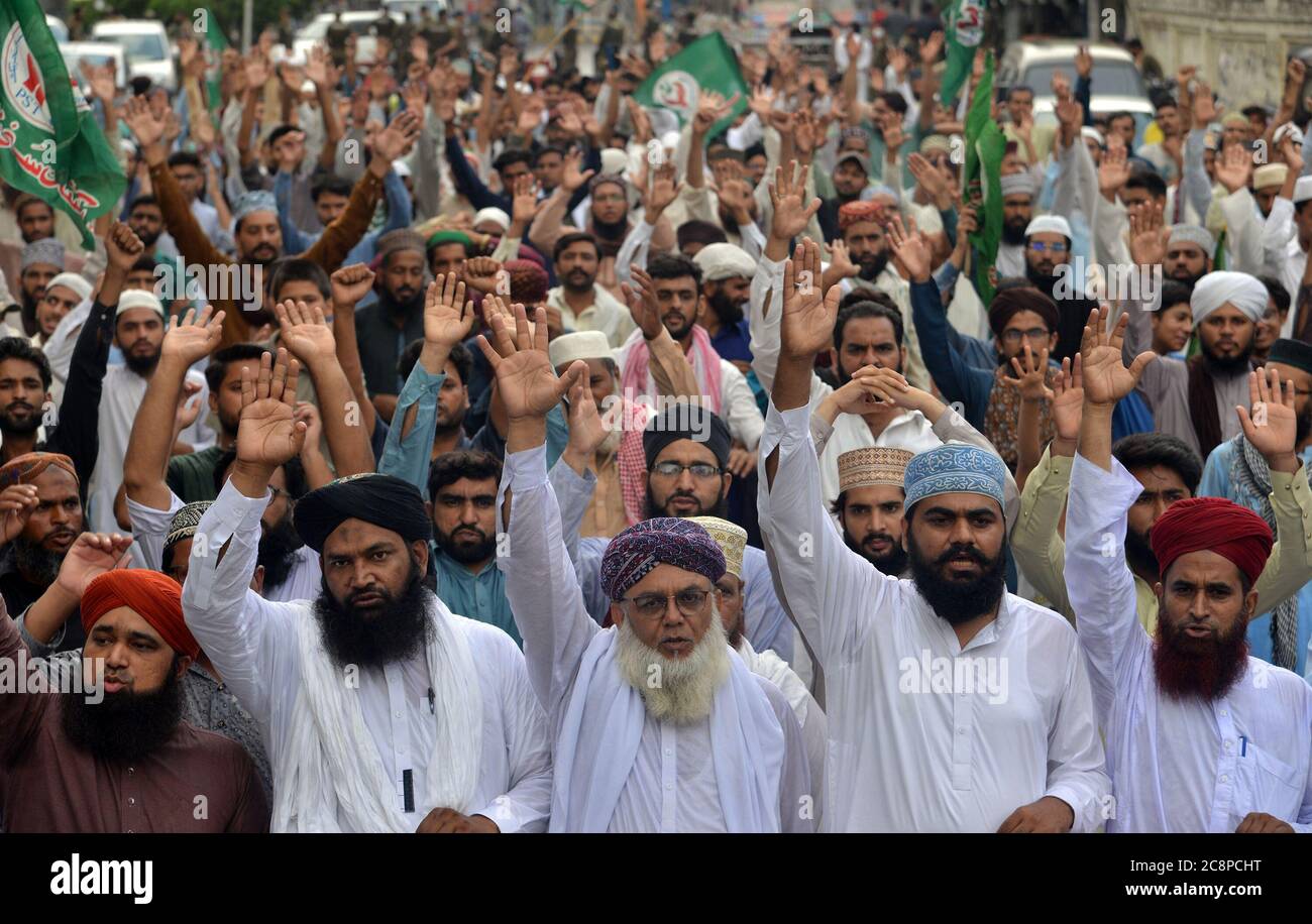 Pakistani activists of Sunni Tehreek (a religious group) are holding ...