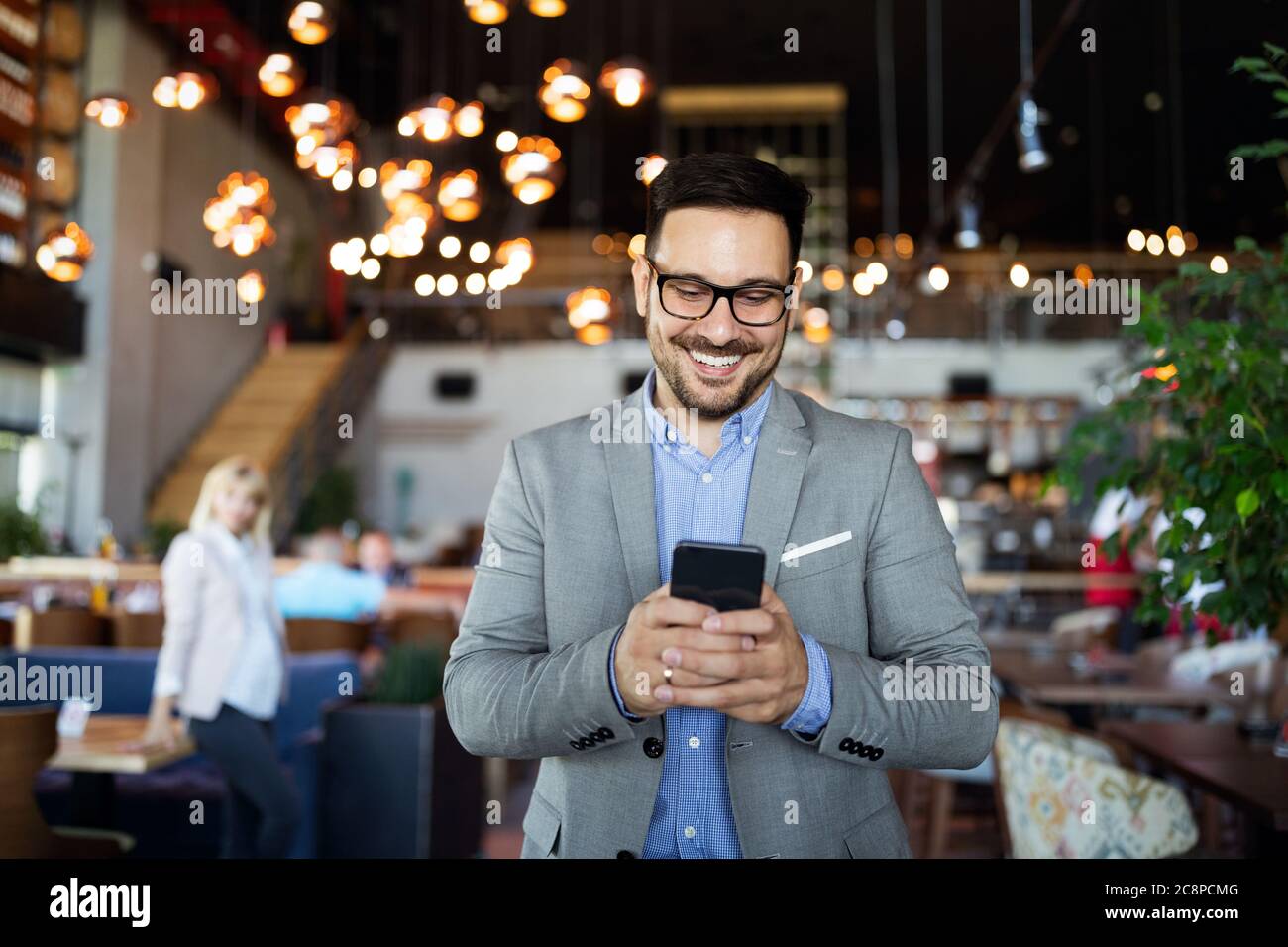Young successful businessman using smartphone hi-res stock photography ...