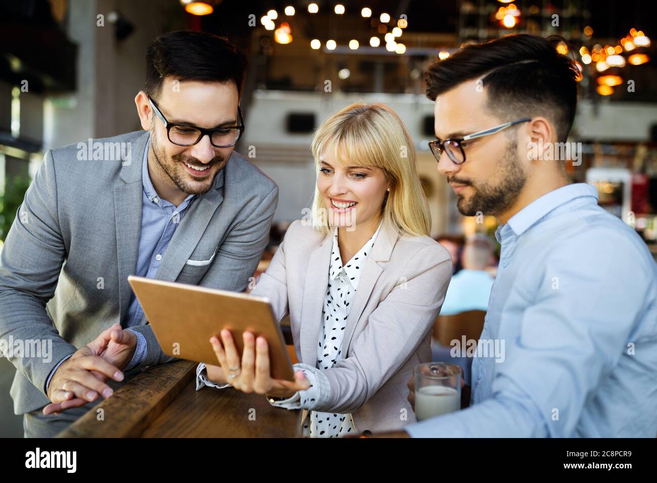 Office colleagues casual discussion during hi-res stock photography and ...
