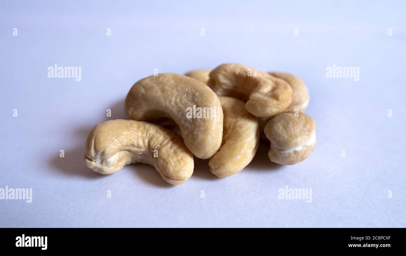 close shot of cashew nuts group isolated on white background Stock ...