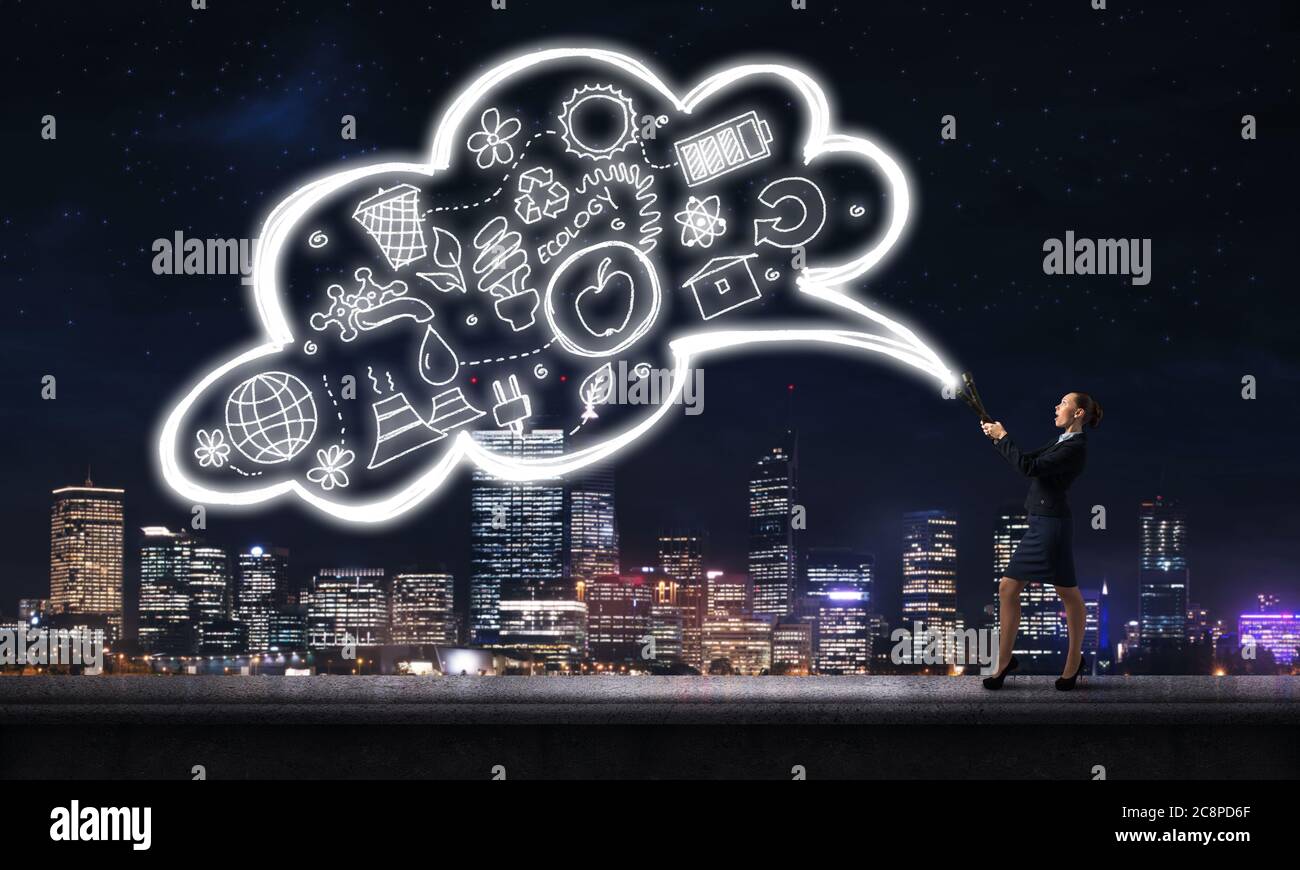 Woman throwing light on her ideas Stock Photo - Alamy