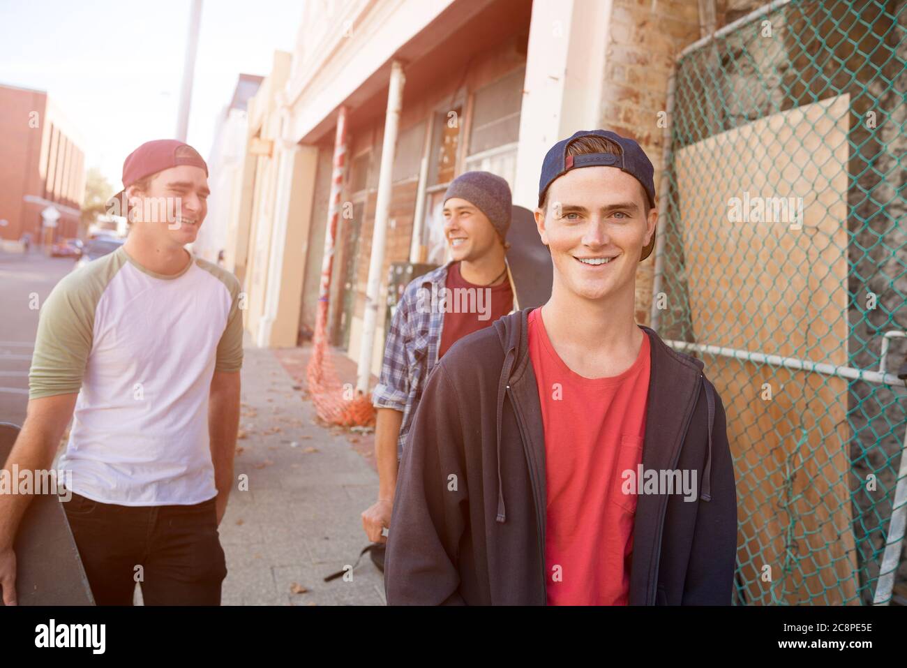 Three guys walking together in hi-res stock photography and images - Alamy