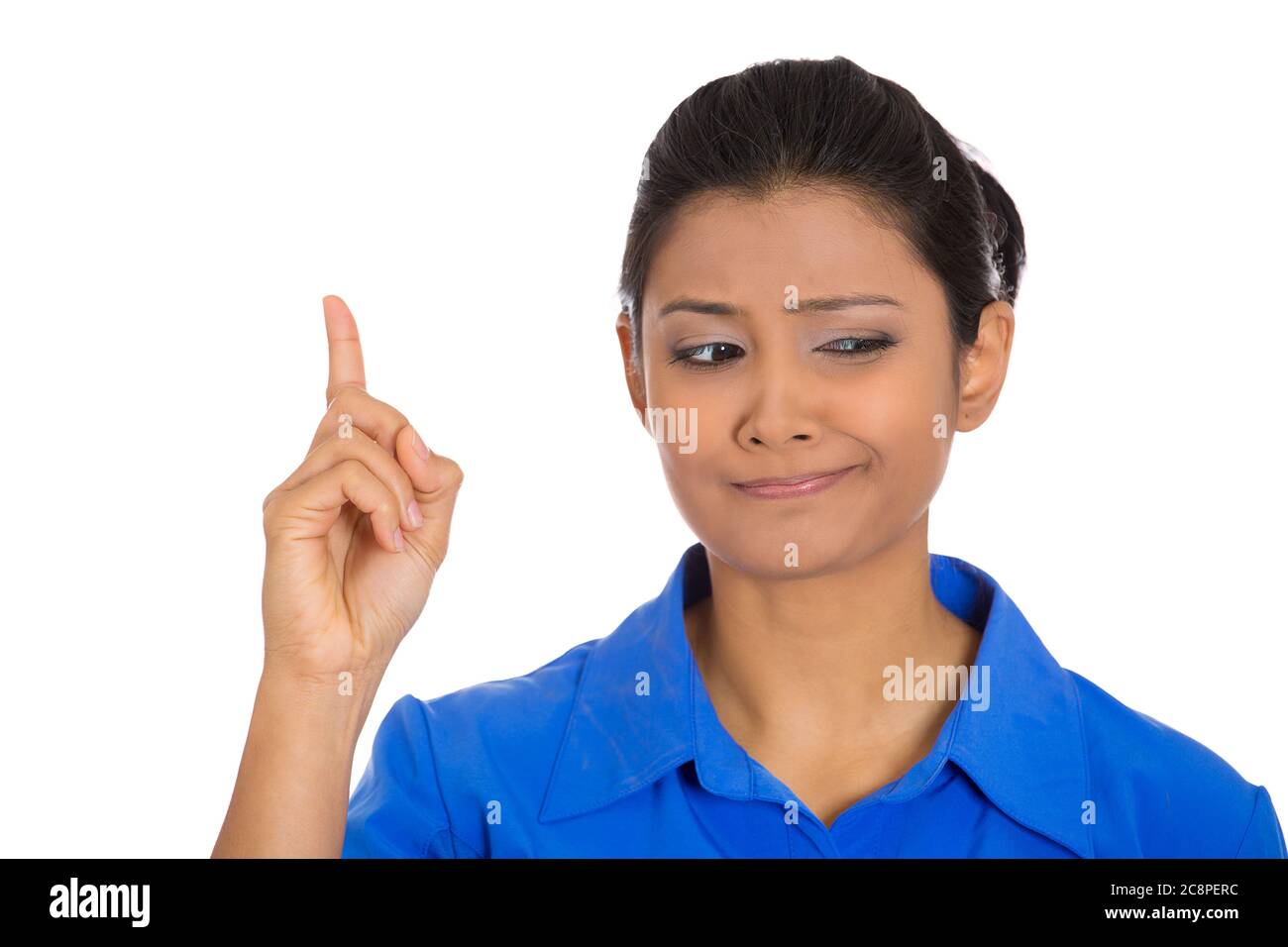 Portrait of a young woman thinking daydreaming about something with ...