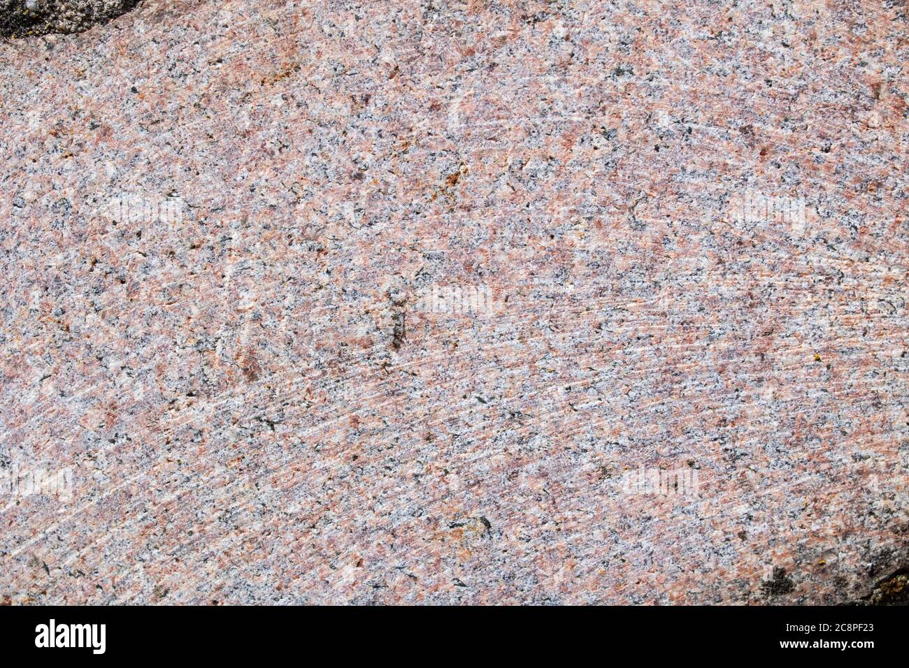 Bright red black granite stone closeup, background Stock Photo - Alamy