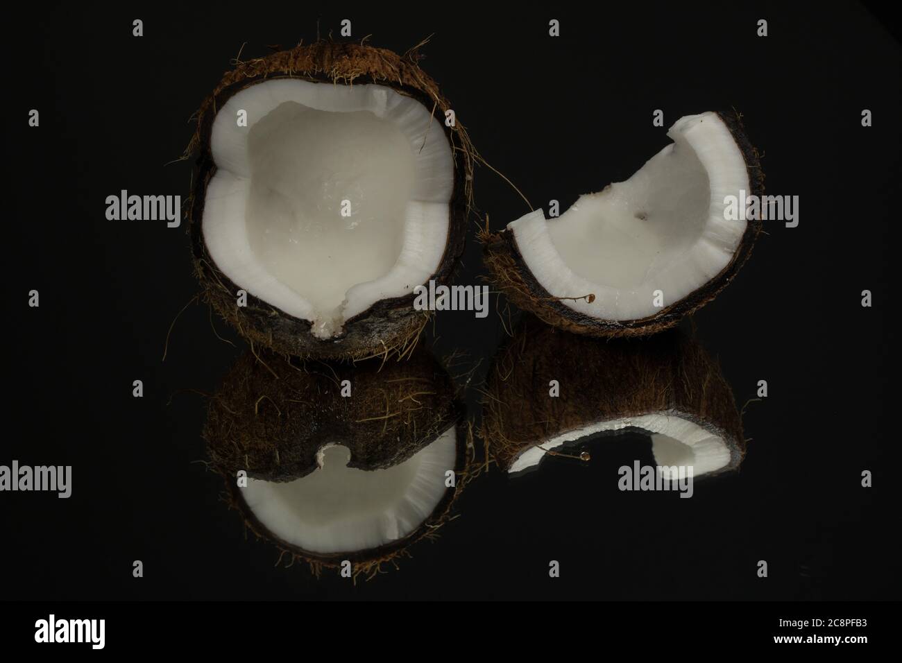 Coconut on a black background. Dark background Stock Photo - Alamy
