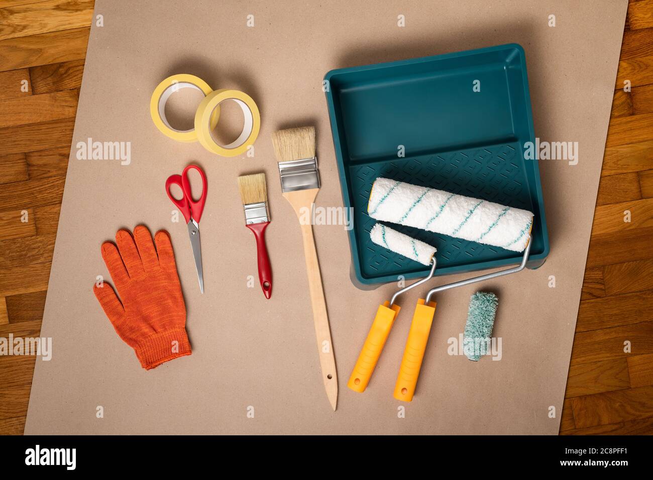 Painting tools and materials. Rollers, masking tape, tray and brush ...