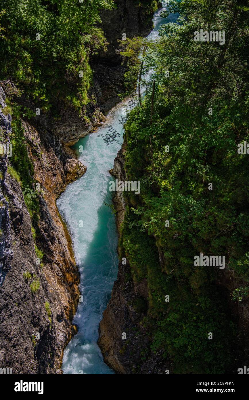 View from above of the clear blue water of the river stream and the ...