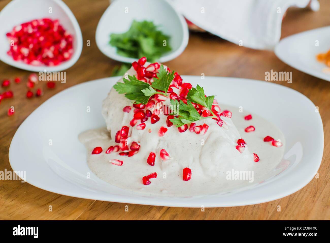 chiles en nogada, traditional Mexican dish with poblano chili peppers ...