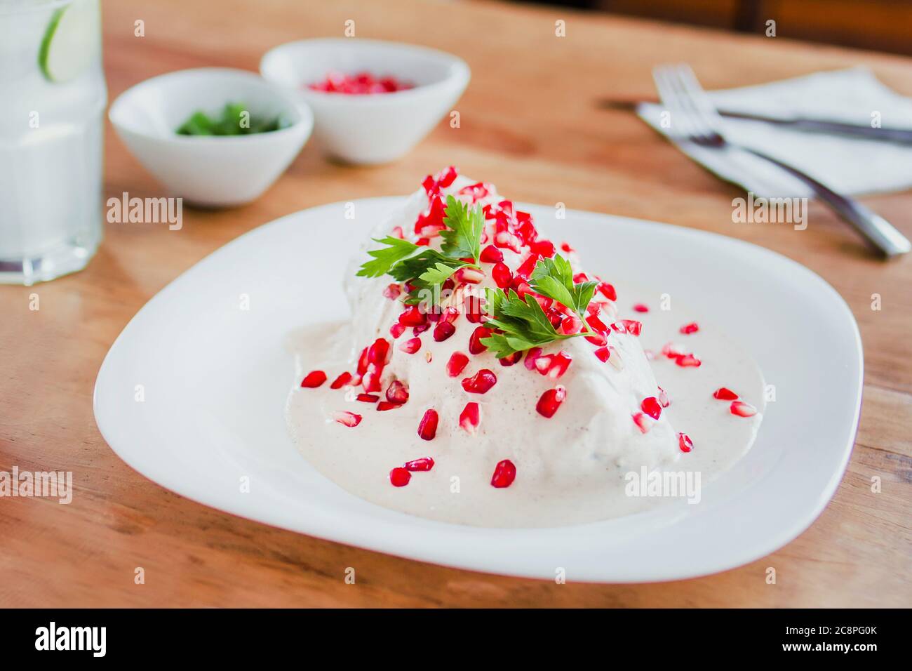 chiles en nogada, traditional Mexican dish with poblano chili peppers ...