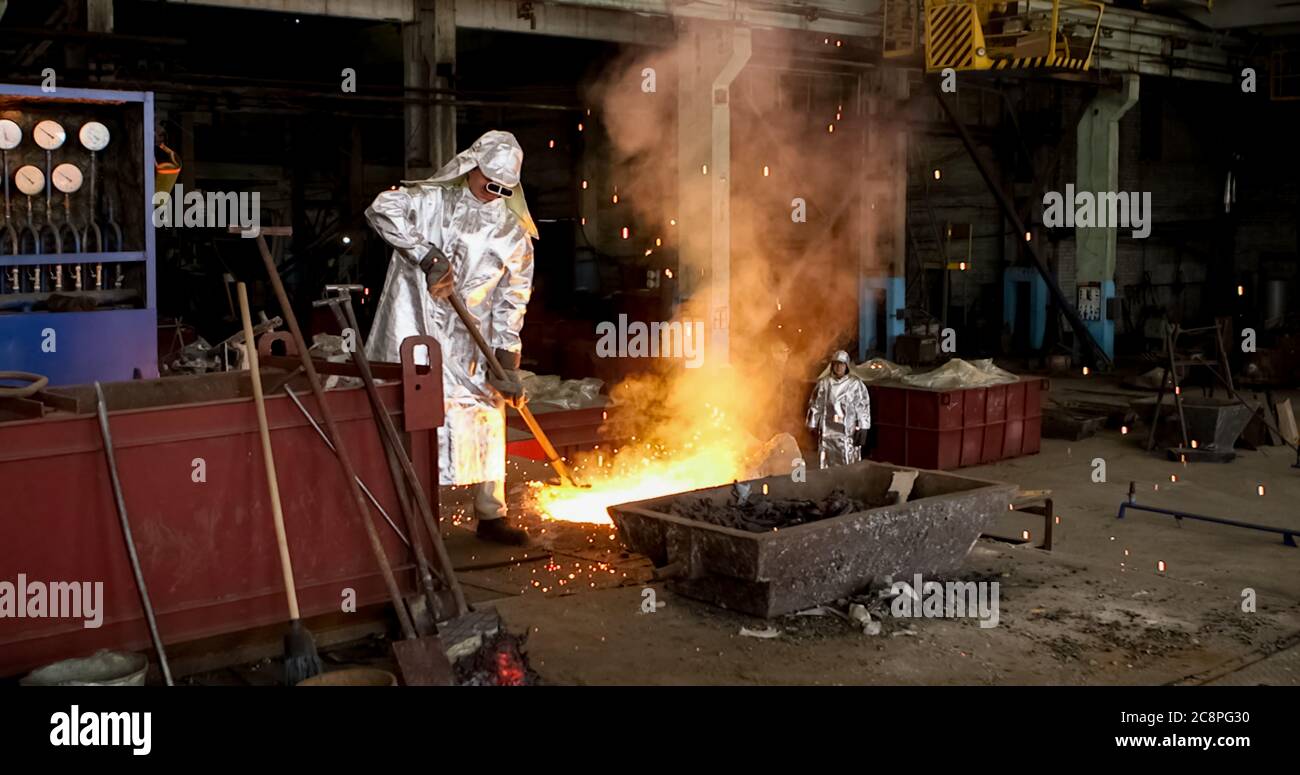red-hot molten steel in a iron and steel enterprise production scene ...