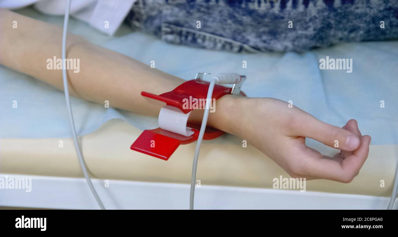 Counting heart rate with device. Сlicking a medical device Stock Photo ...