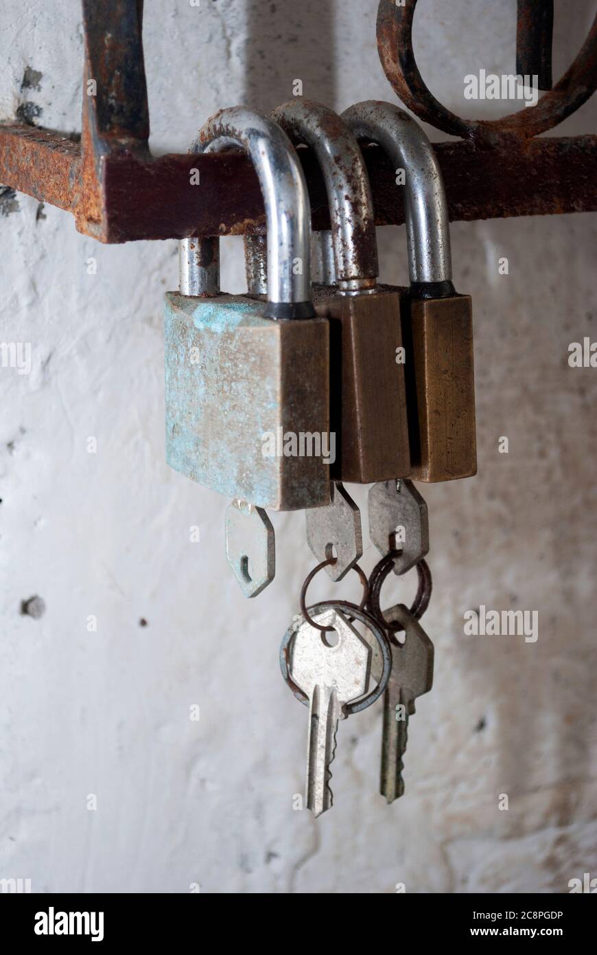 Old metal locks outdoors, rusty and neglected with their keys on Stock ...