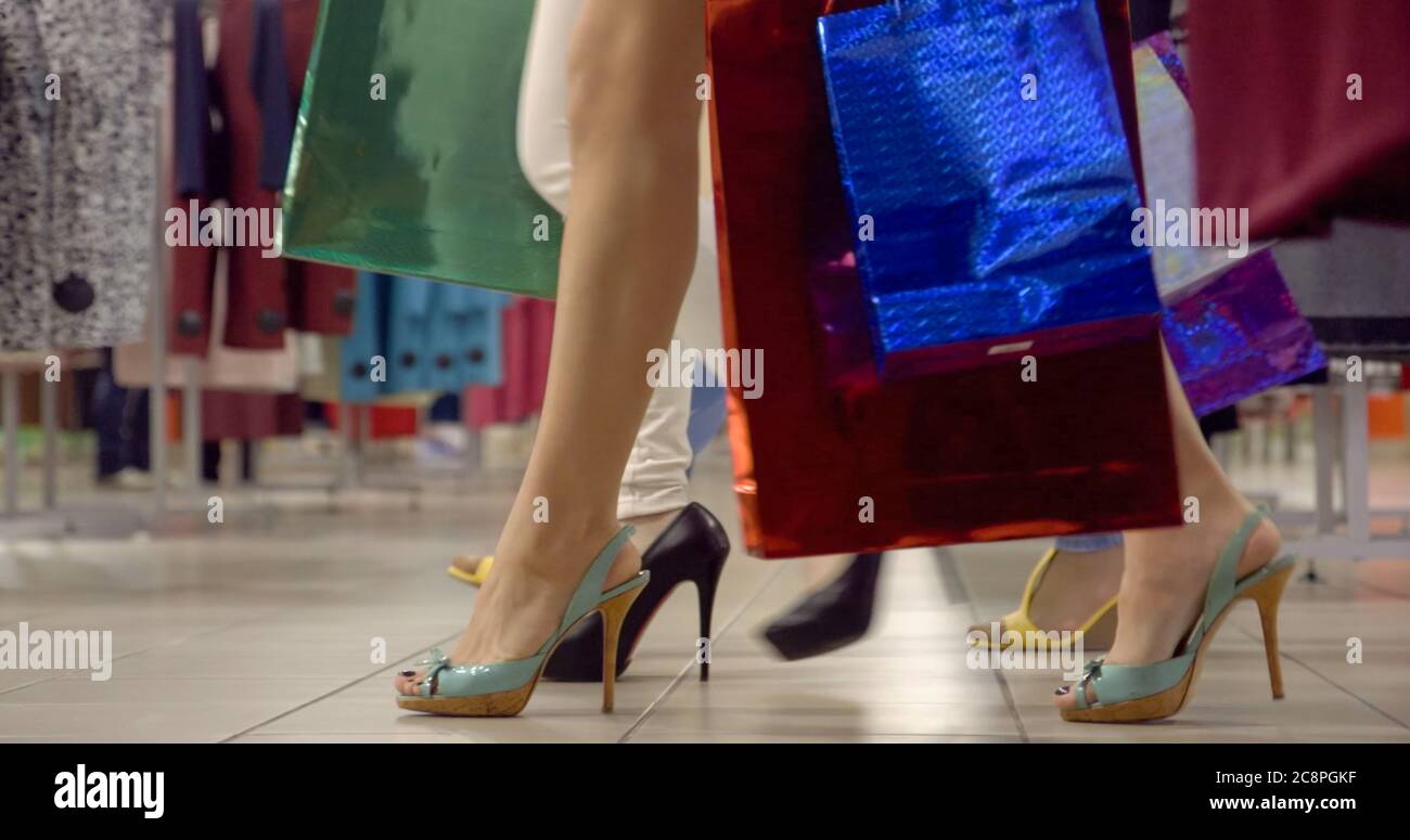 Three young female friends in a shopping, making fun Stock Photo - Alamy
