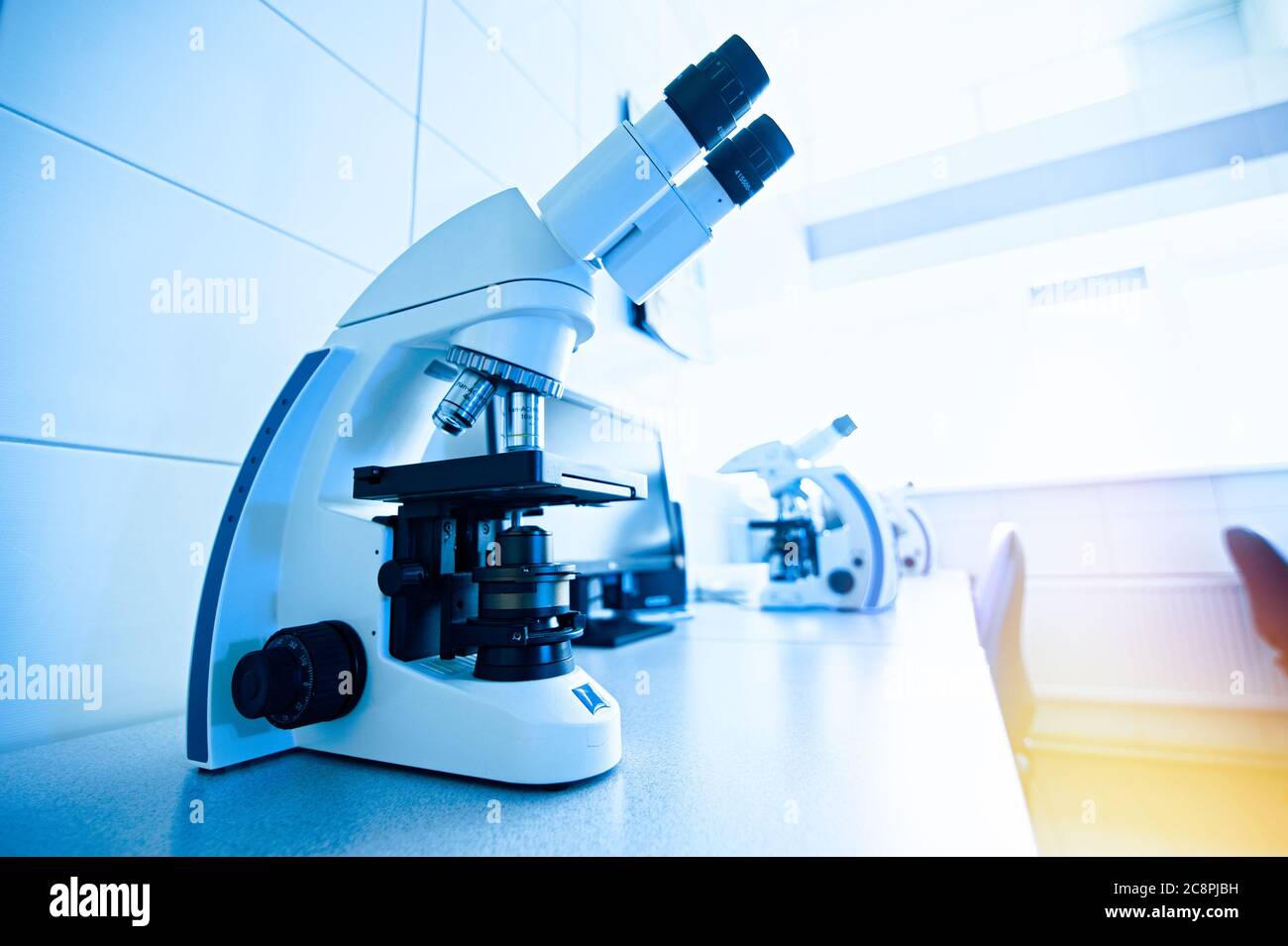 Cytological examination in the laboratory. Close - up of Microscopes in ...