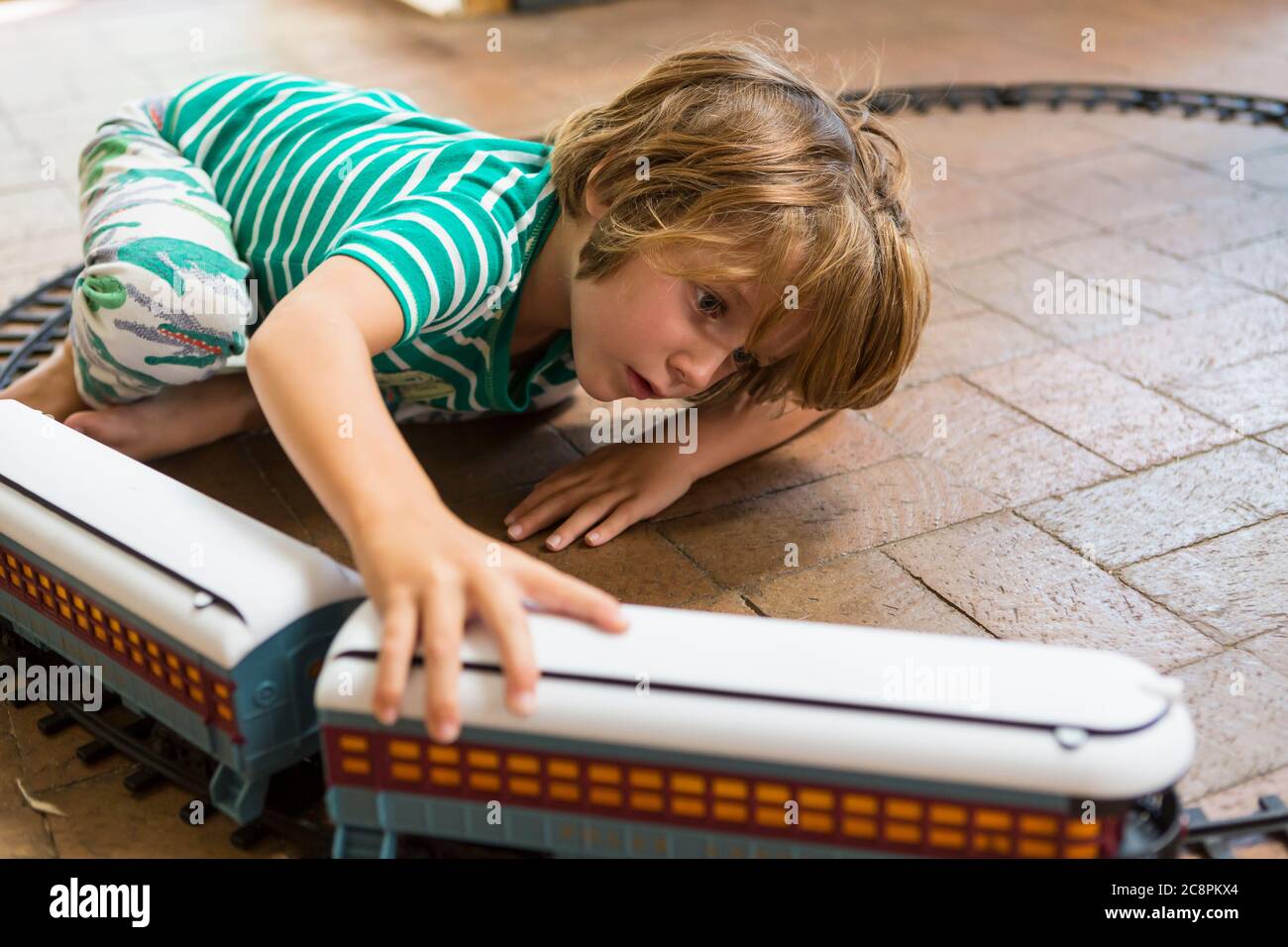 Boy playing toy train hi-res stock photography and images - Alamy