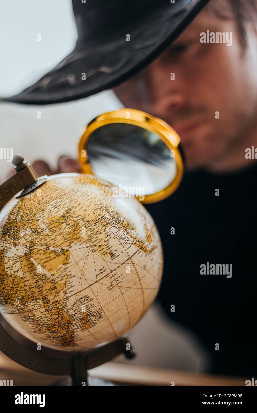 Archaeologist traveler in search of adventure - a man in a hat and with ...