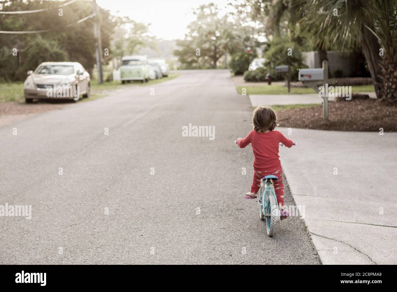 Boy red bike rear view hi-res stock photography and images - Alamy
