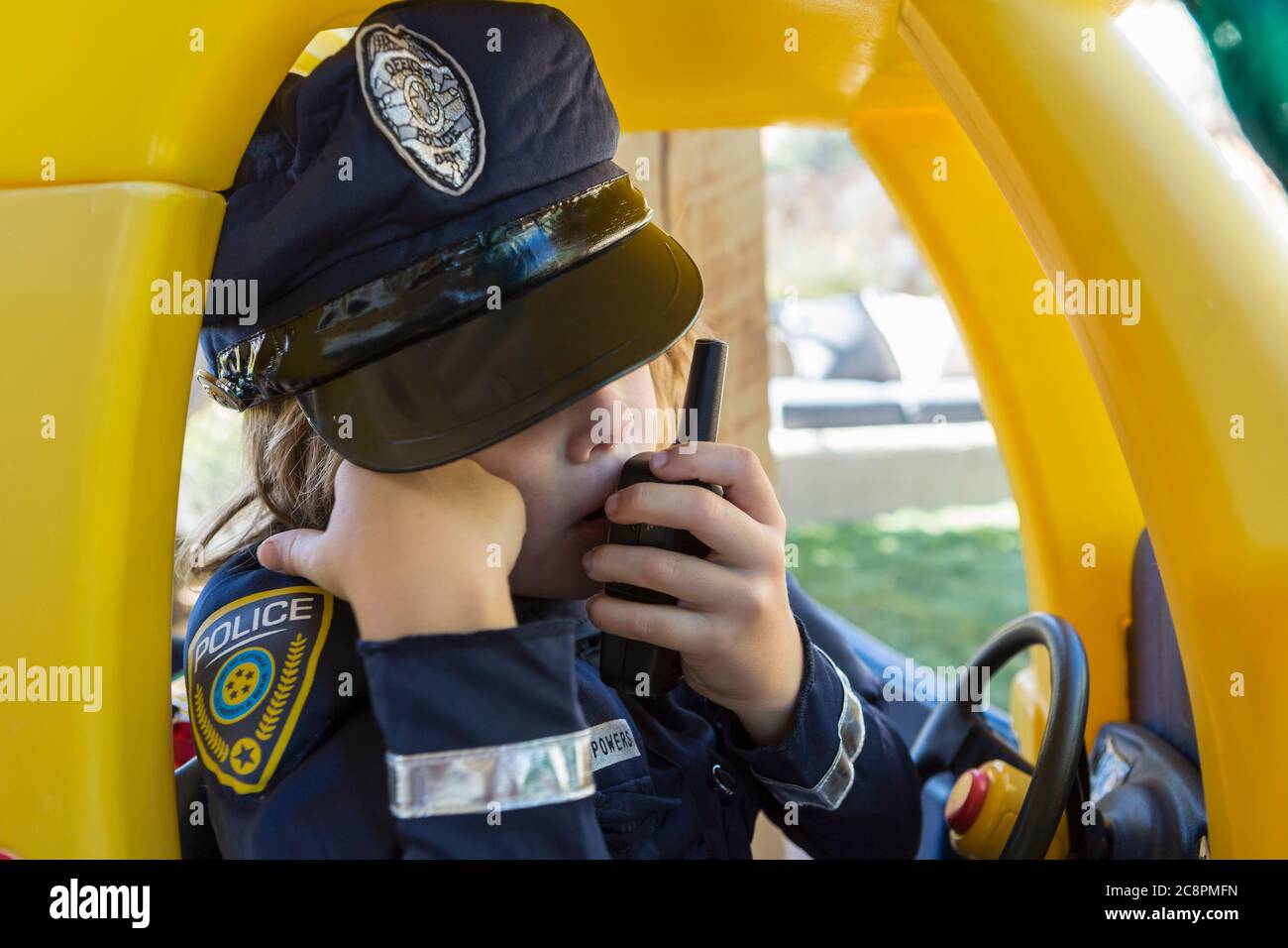 4 year old boy dressed as a police officer Stock Photo - Alamy