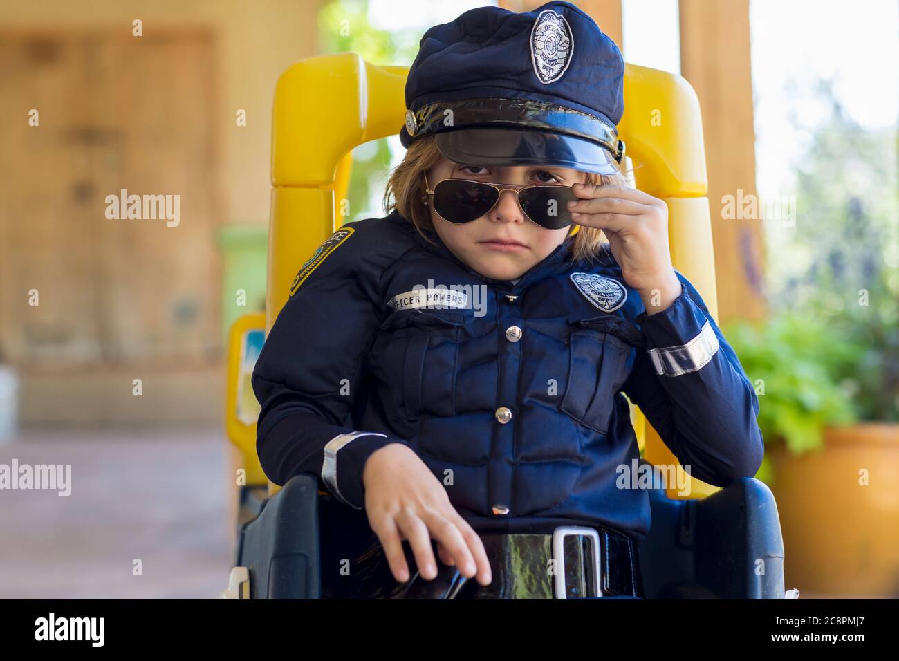 4 year old boy dressed as a police officer Stock Photo - Alamy