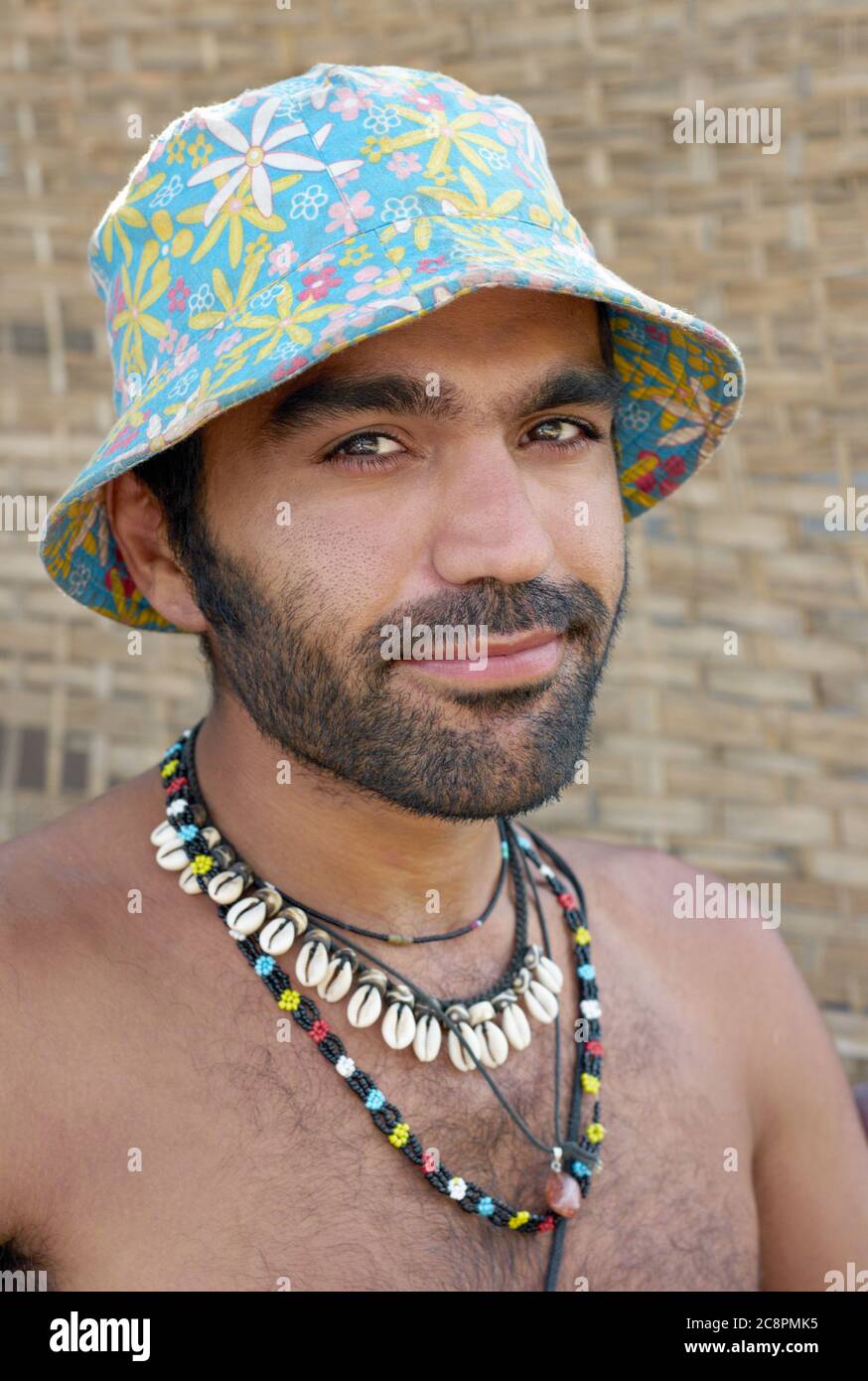 Man with a colourful hat Stock Photo - Alamy