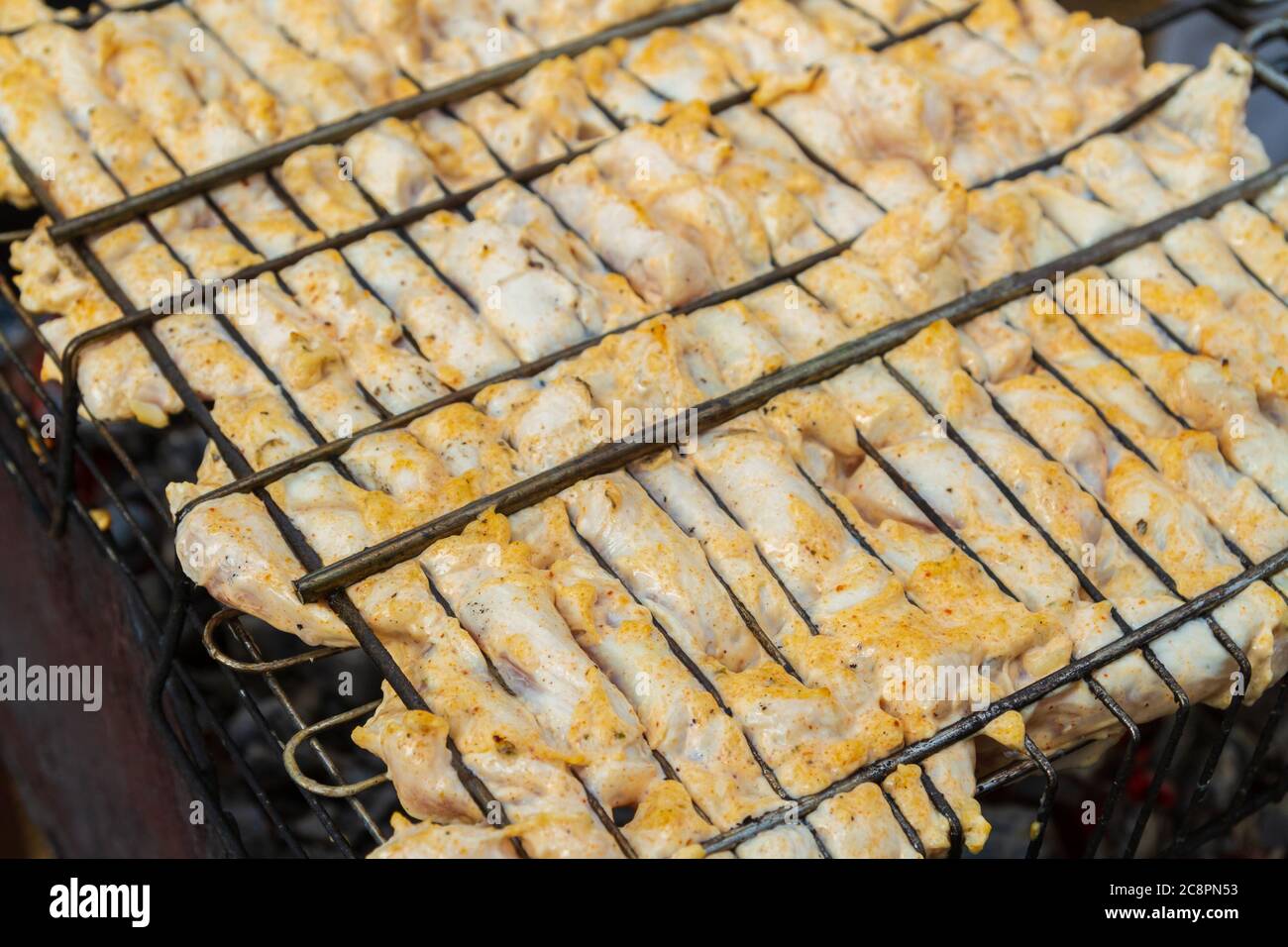 Chicken shish kebab on the grill is prepared on the grill Stock Photo ...
