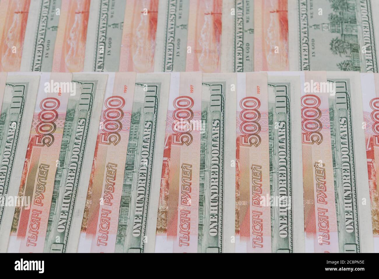 A large number of American hundred dollar bills and Russian five ...