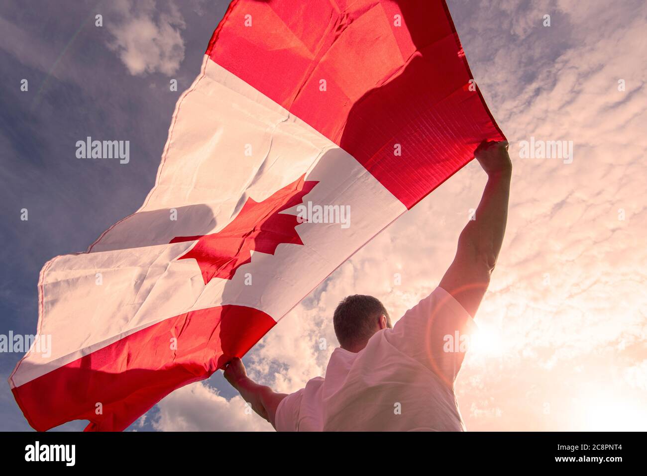 Canadian man holding canadian flag hi-res stock photography and images ...