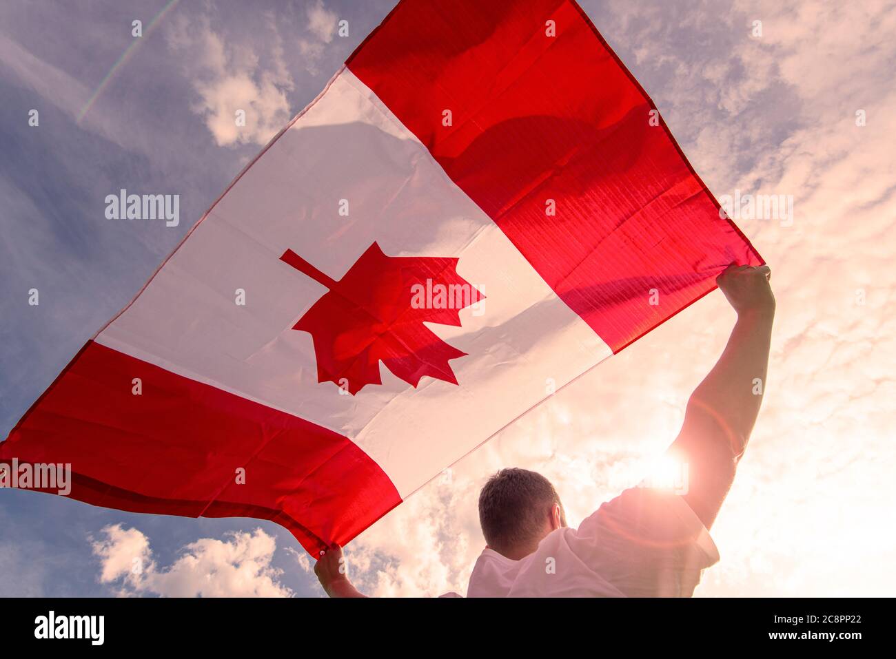 Canadian man holding canadian flag hi-res stock photography and images ...