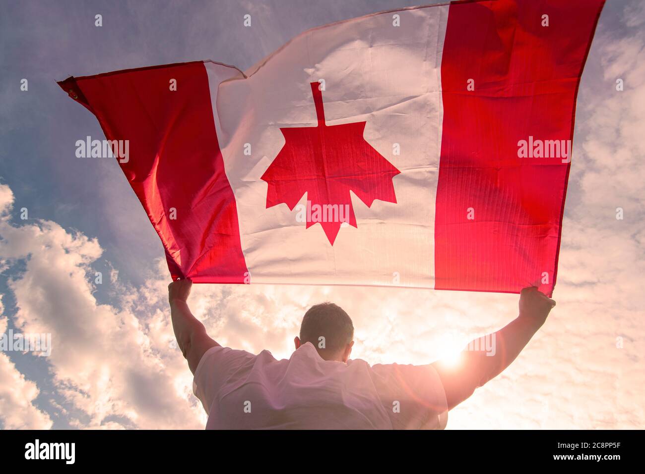 Canadian man holding canadian flag hi-res stock photography and images ...