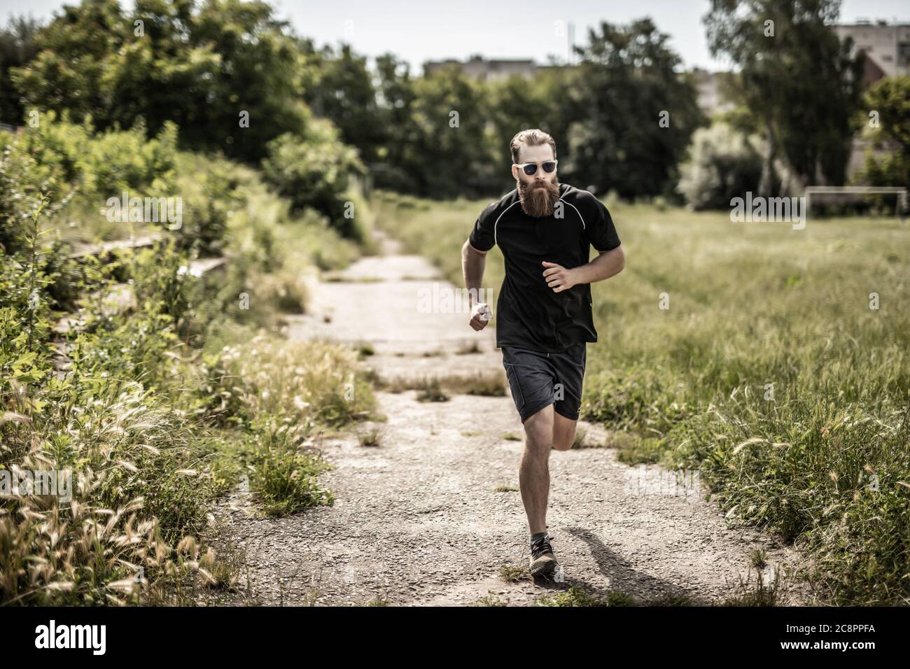 Athletic bearded man running in hi-res stock photography and images - Alamy