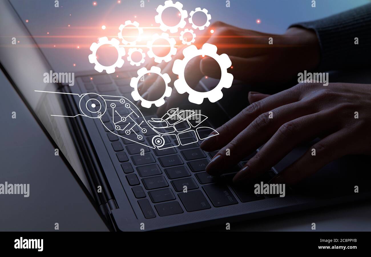 Connected gears on cyborg hand over working person Stock Photo - Alamy