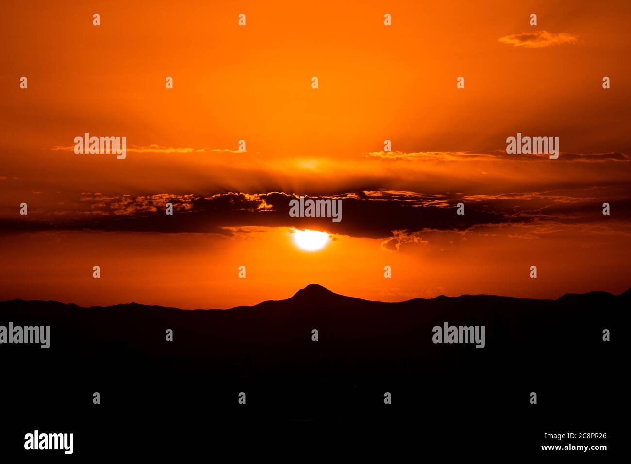 Sunsetting behind the clouds hi-res stock photography and images - Alamy