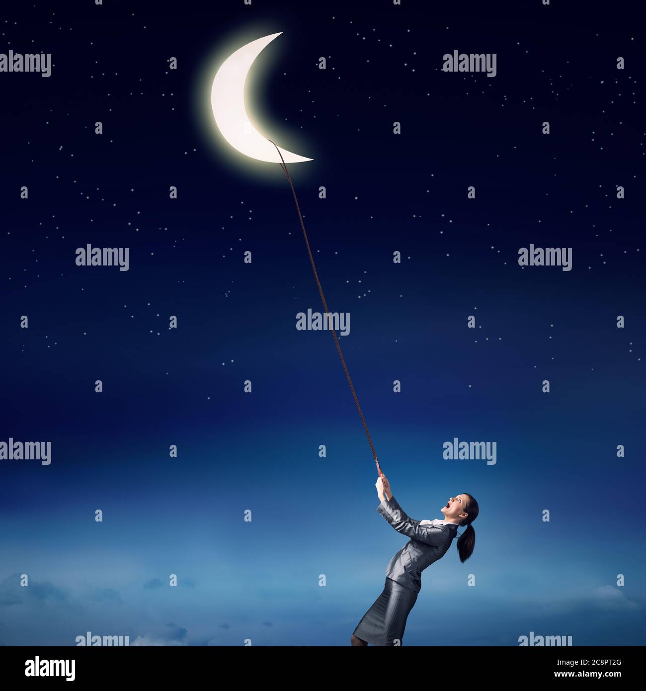 Woman catch moon Stock Photo - Alamy