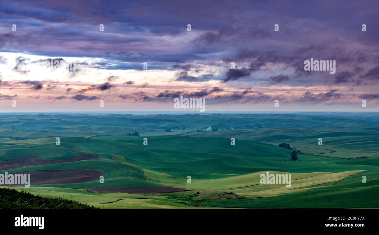 Clouds loom over farm fields as rain fall from the sky Stock Photo - Alamy