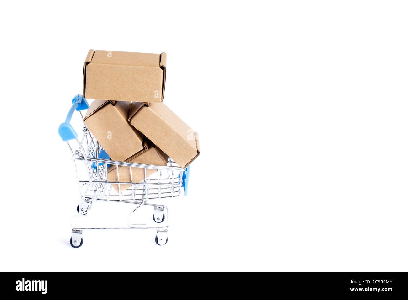 Shopping cart full of cardboard boxes, isolated on white background ...