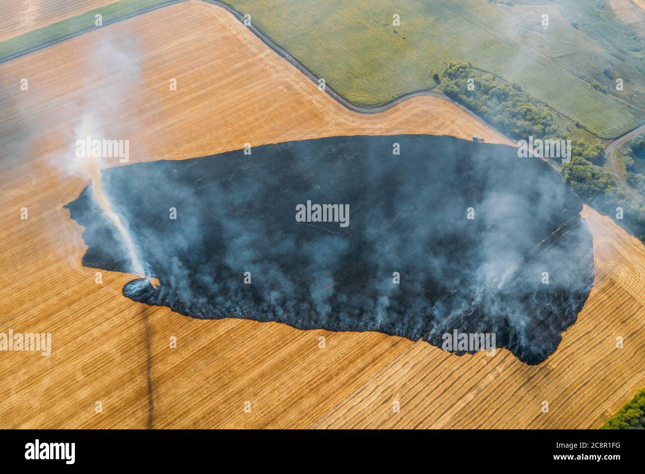 Farm field in fire, aerial view. Burning agricultural rye field, small ...