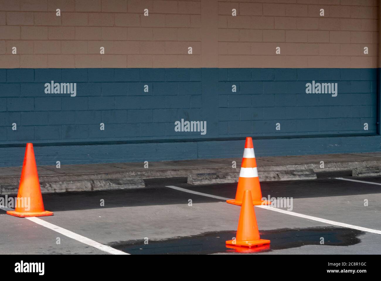 Cone signage in parking area in shopping center, reserved and empty ...