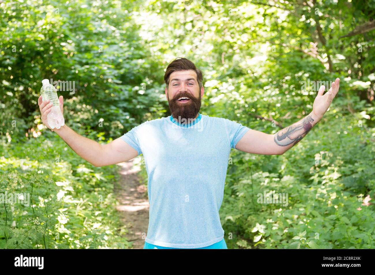 Give Plenty Of Water. sport and fitness clothes. Confident handsome ...