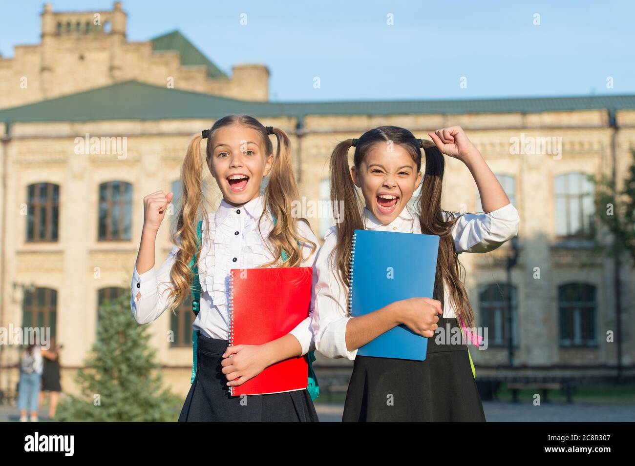 Sisters girls study together in school, successful graduation concept ...